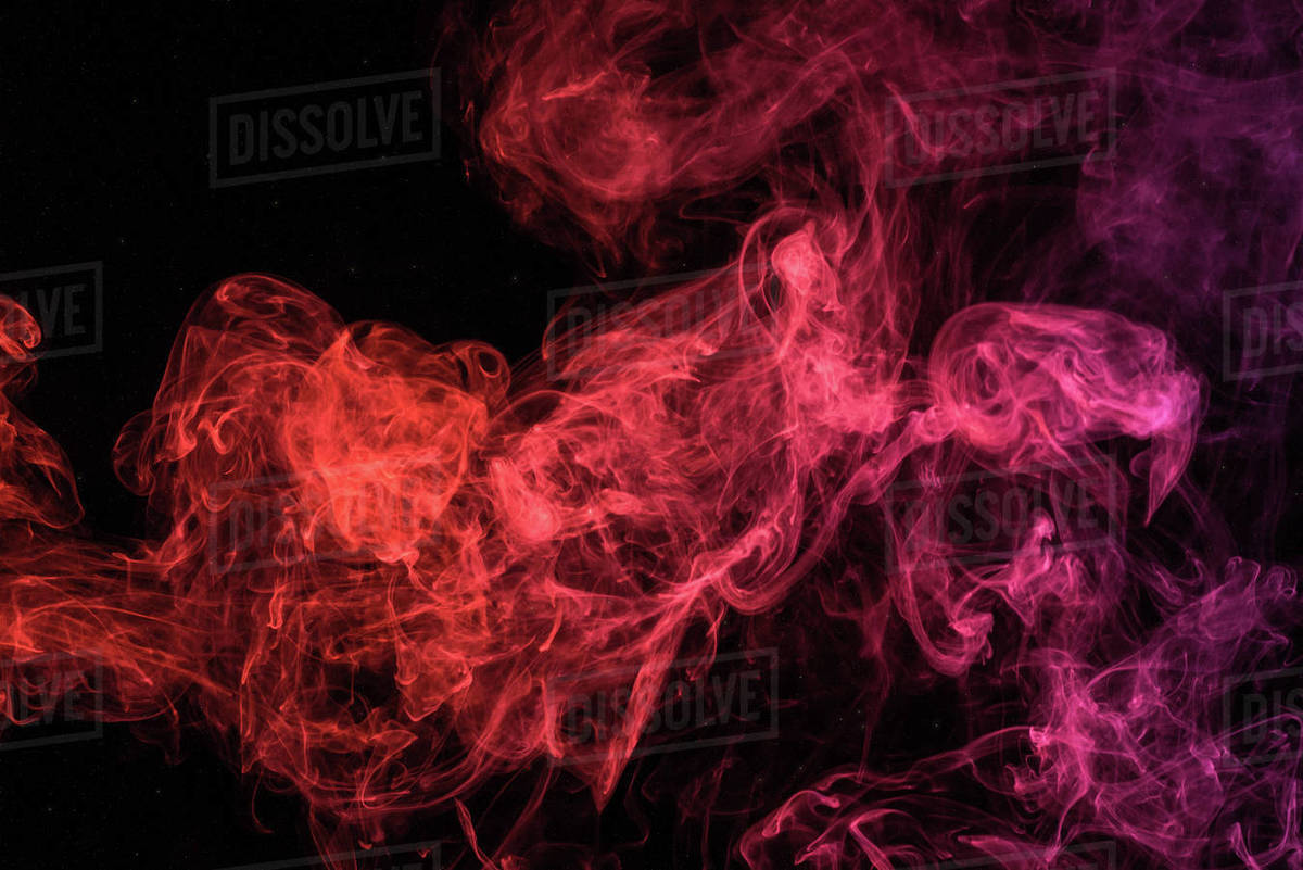 Red spiritual smoke on black background - Stock Photo - Dissolve
