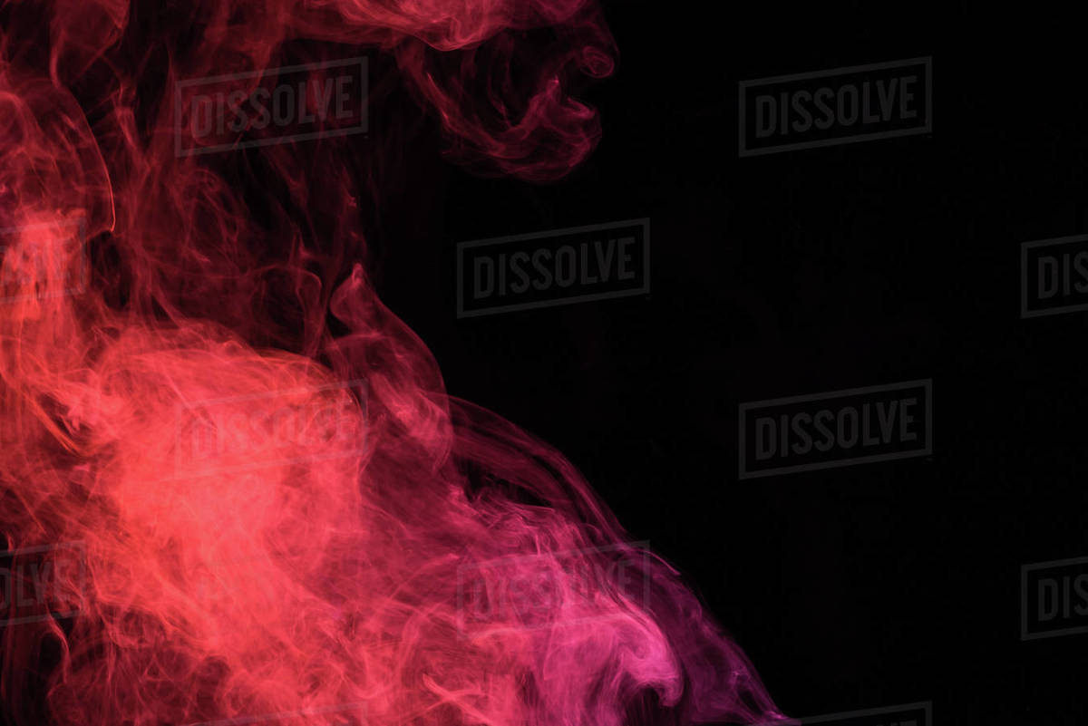 Red smoke on black background with copy space - Stock Photo - Dissolve
