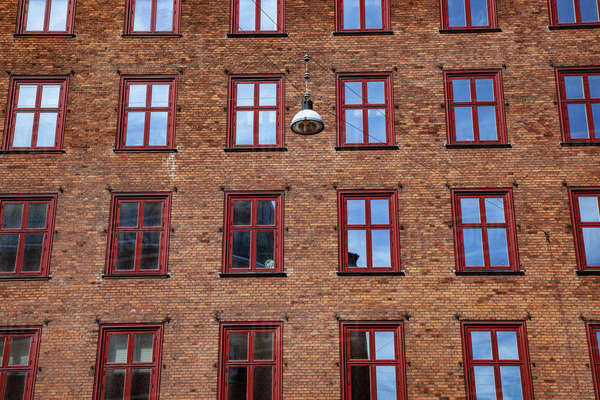 Full frame of city building brick wall with windows in Copenhagen ...