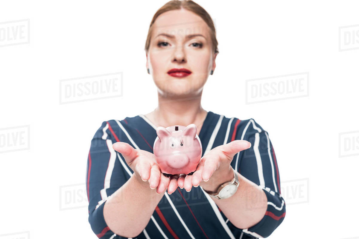 Beautiful female accountant showing pink piggy bank isolated on white ...