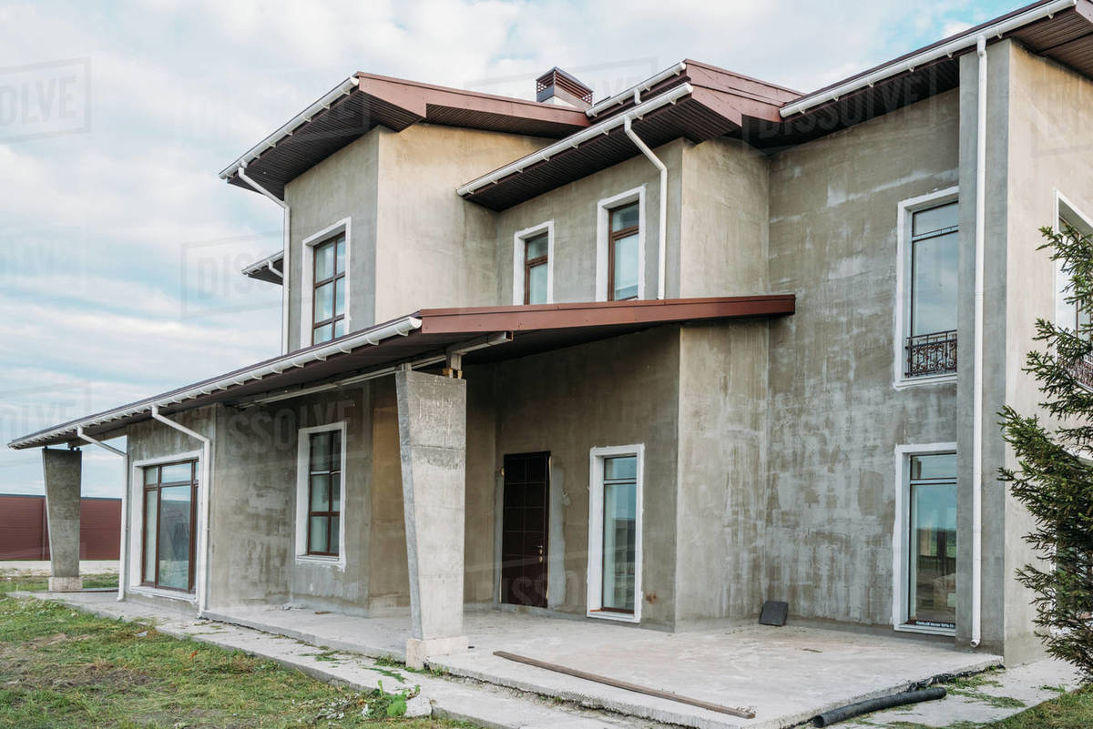 unfinished concrete building under cloudy sky - Stock Photo - Dissolve