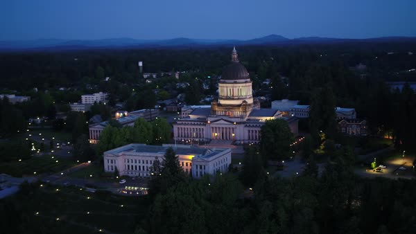 Night aerial in downtown Olympia with the centerpiece lit up great dome ...