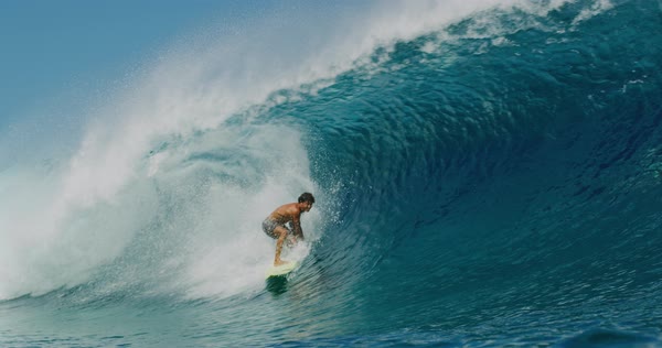 TEAHUPOO, TAHITI - August 5, 2019: Professional surfer rides amazing ...