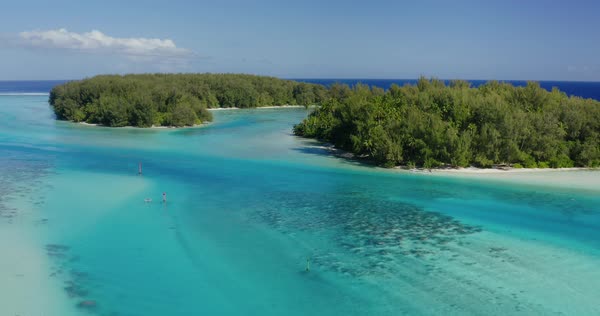 Aerial view of small pacific island motu's with palm trees and calm ...
