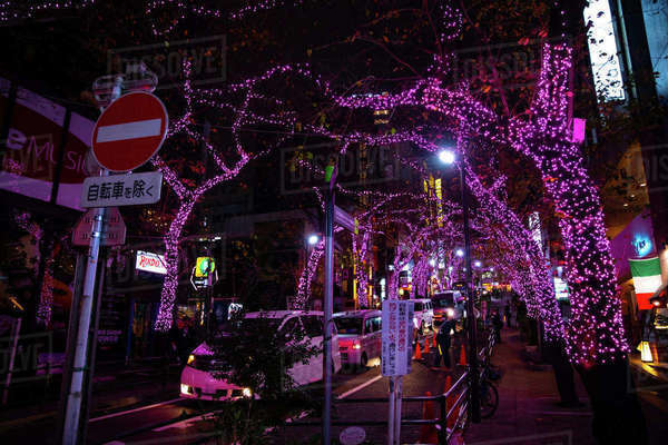 A night illuminated street in Shibuya wide shot. Shibuya district ...