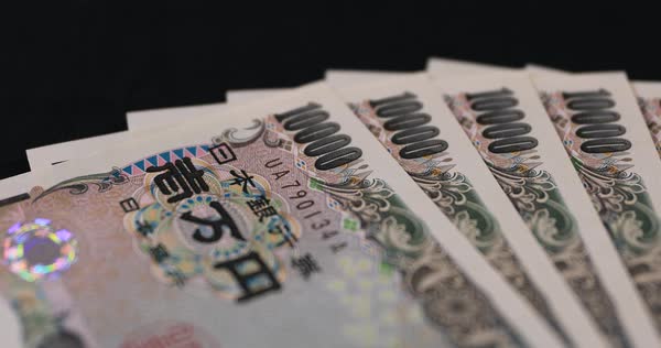 Japanese currency 100,000 yen on the black background panning - Stock ...