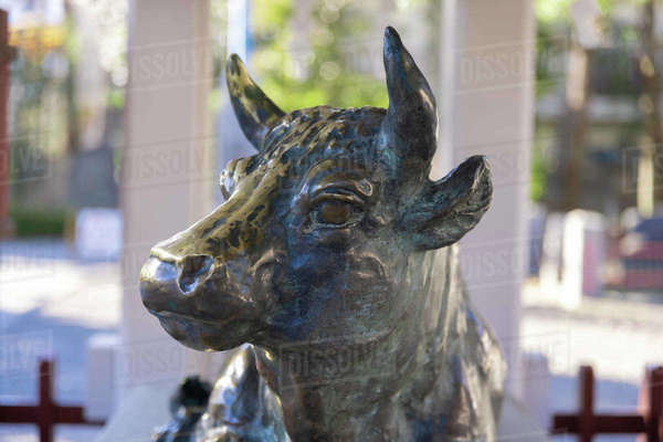 A guardian statue of cow at Kameido Tenjin shrine closeup - Royalty ...