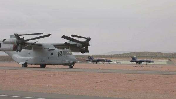 Navy Blue Angel air demonstration F18 Hornet fighter jets taxi past V22 ...