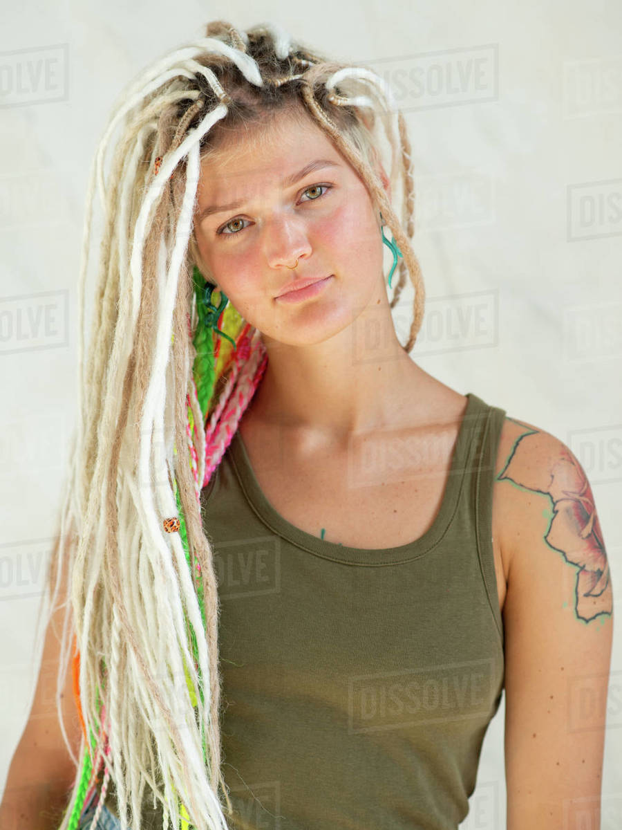 Woman with dreadlocks looking at camera - Stock Photo - Dissolve