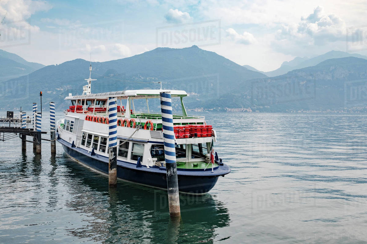 Ferry docked at a jetty, Menaggio, Lake Como, Lombardy, Italy - Royalty ...