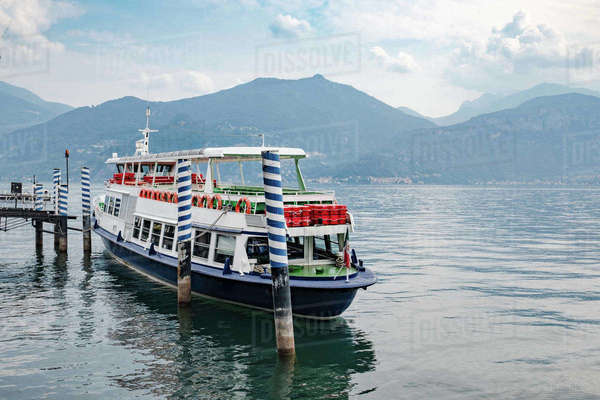 Ferry docked at a jetty, Menaggio, Lake Como, Lombardy, Italy - Royalty ...