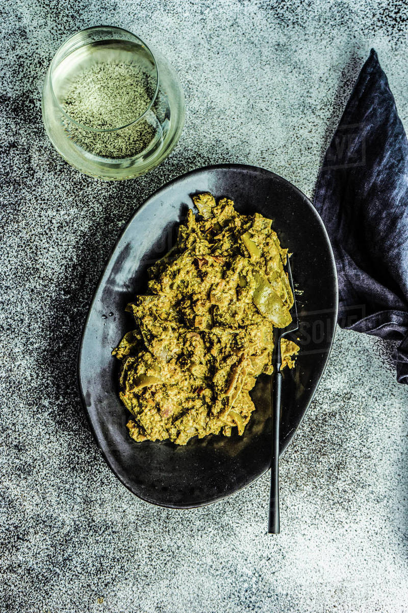 Overhead view of a bowl of traditional Georgian lobio with walnuts and ...