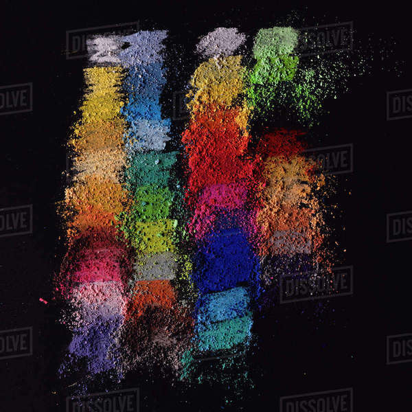 Overhead view of multi coloured chalk powder on a blackboard - Royalty ...