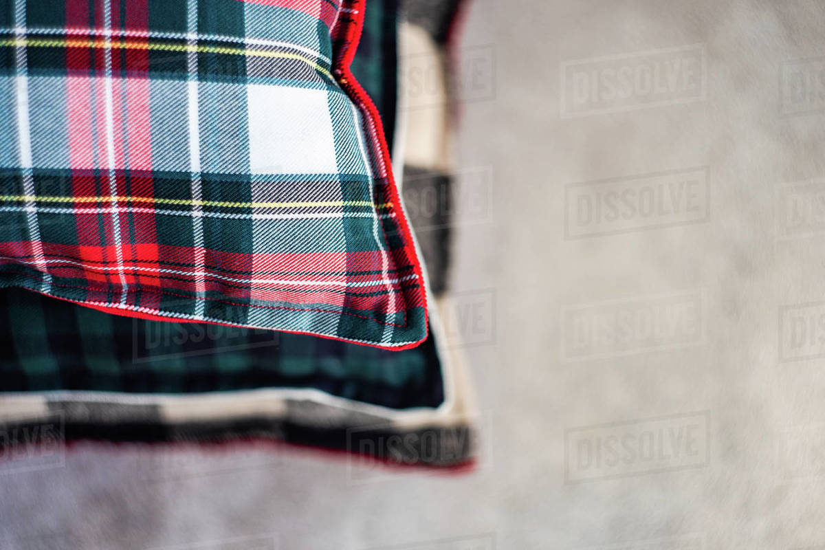 Close-up of a stack of assorted pillows with various checked patterns ...