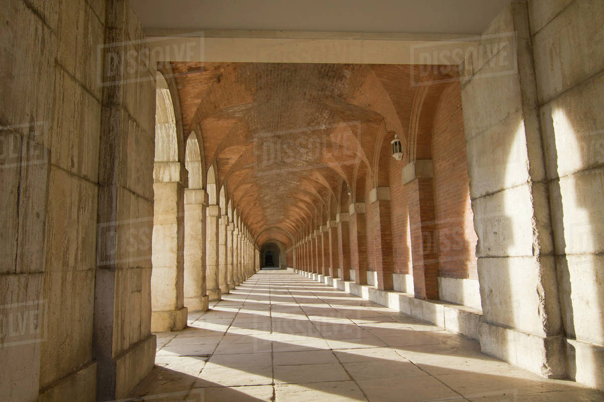 Sunlight through the columns on walkway, Royal Palace, Aranjuez, Madrid ...