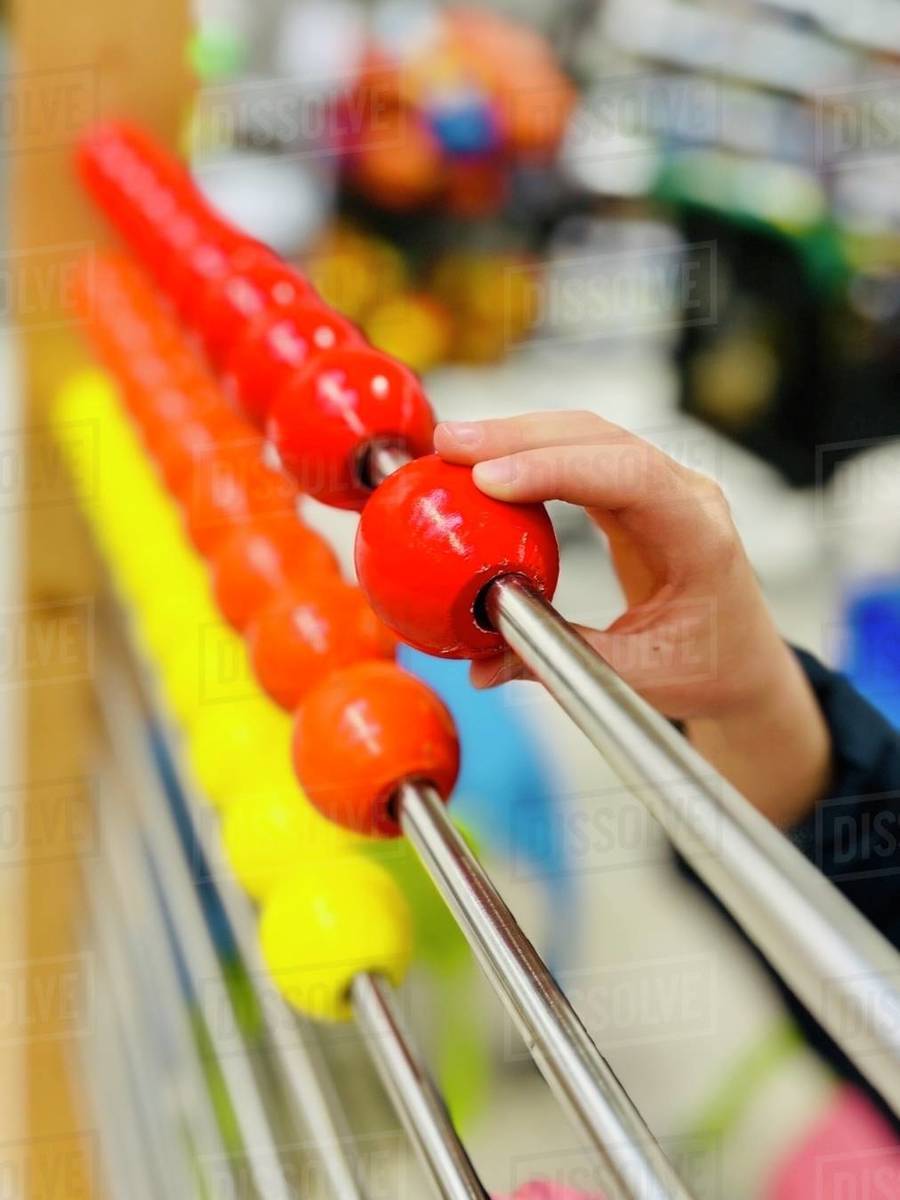 Close-up of a child's hand counting on an abacus - Royalty-free Stock ...