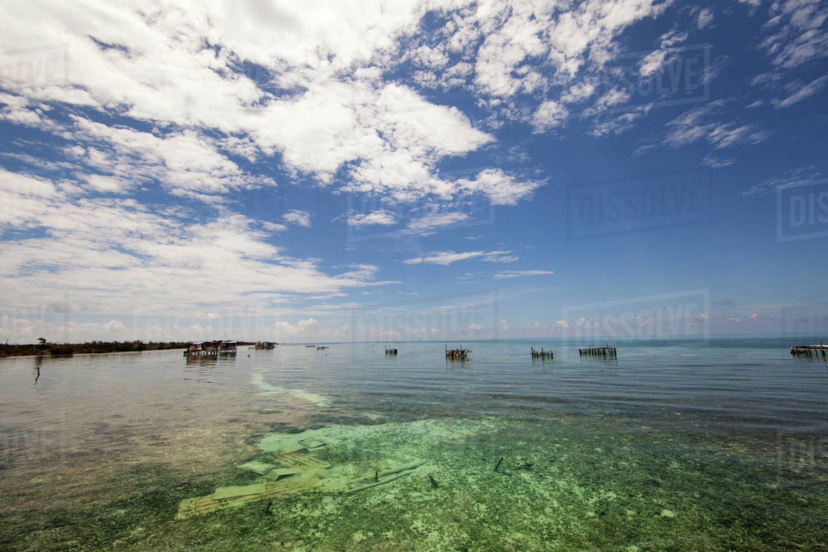 Mexico, Banco Chinchorro, White clouds over shallow sea - Stock Photo ...