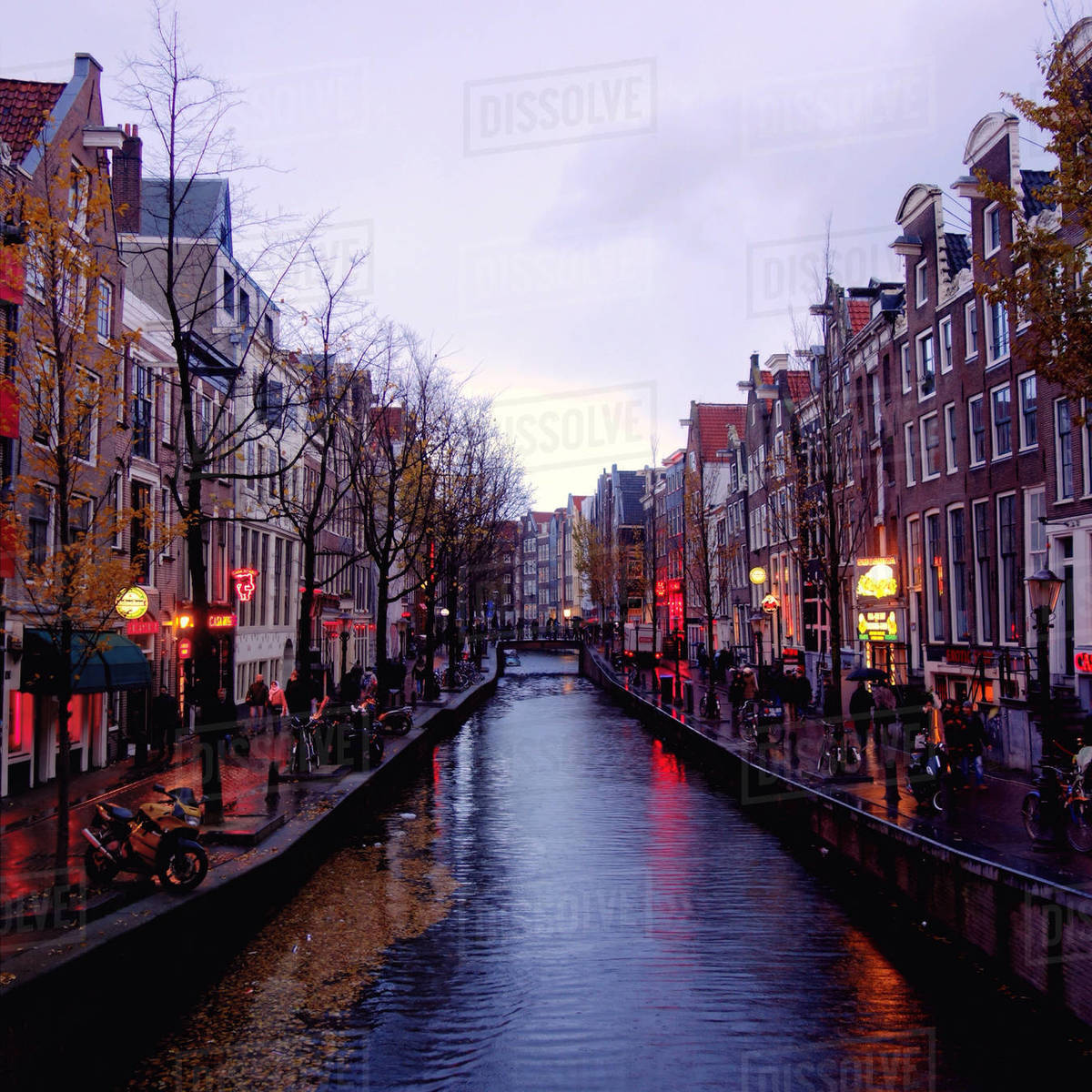 Symmetrical view of streets by canal at dusk - Royalty-free Stock Photo ...