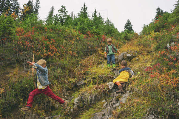 Three children walking down a mountain - Royalty-free Stock Photo ...