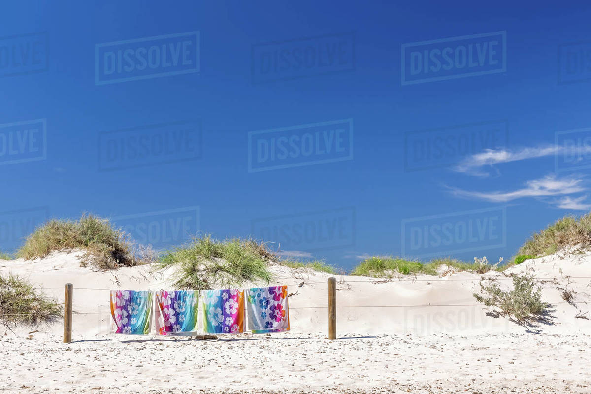 Towels hanging on washing line on beach - Royalty-free Stock Photo ...