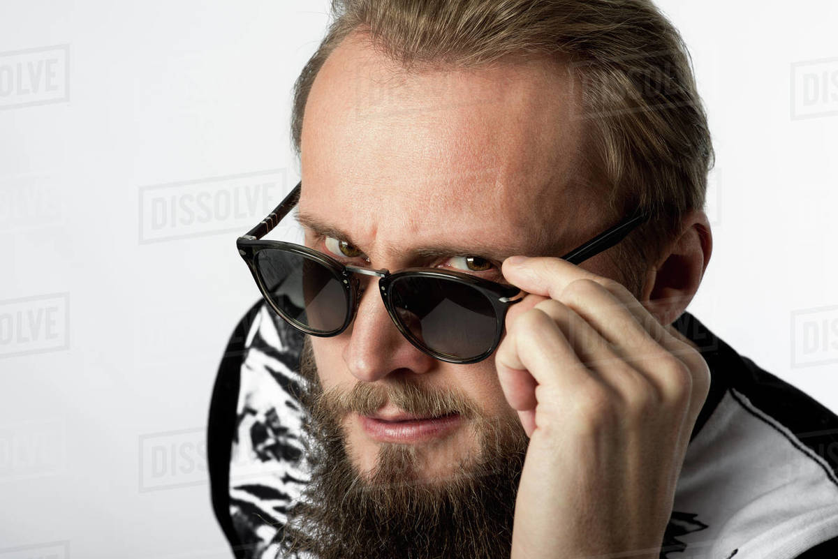 Man looking over sunglasses - Royalty-free Stock Photo | Dissolve