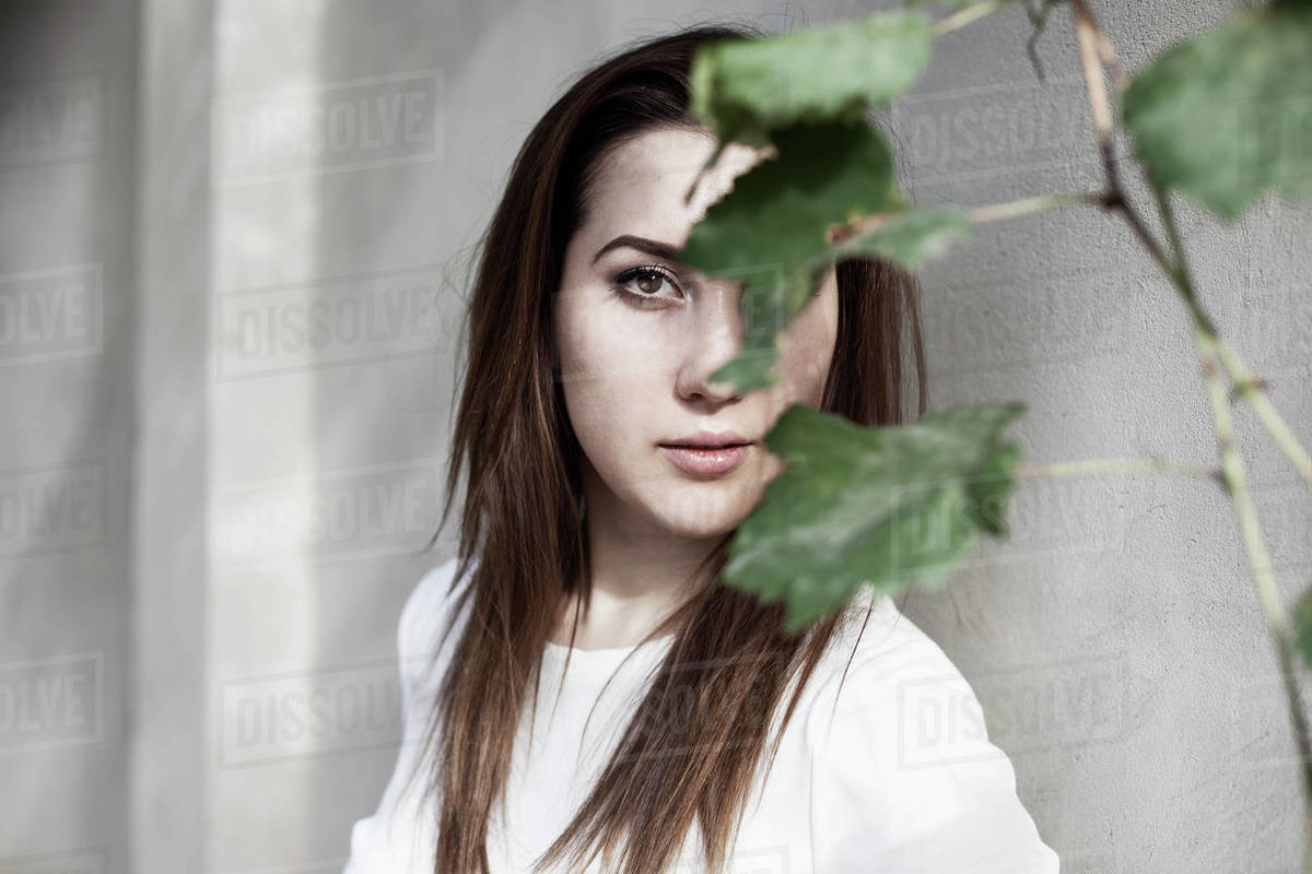 Portrait of a woman with face obscured by leaves - Royalty-free Stock ...