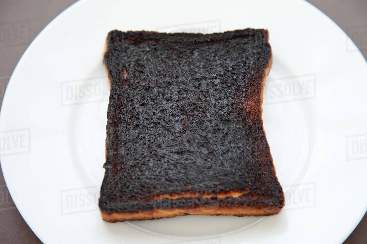 Slice of burnt toast on a plate - Royalty-free Stock Photo | Dissolve