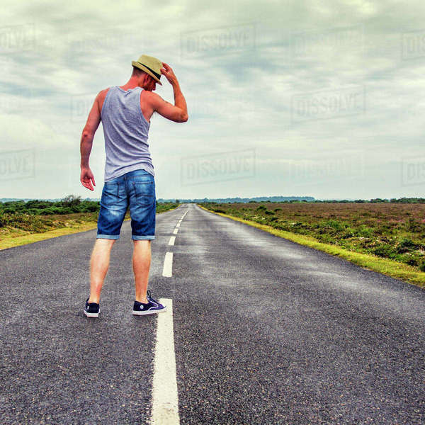 Man standing in the road - Royalty-free Stock Photo | Dissolve