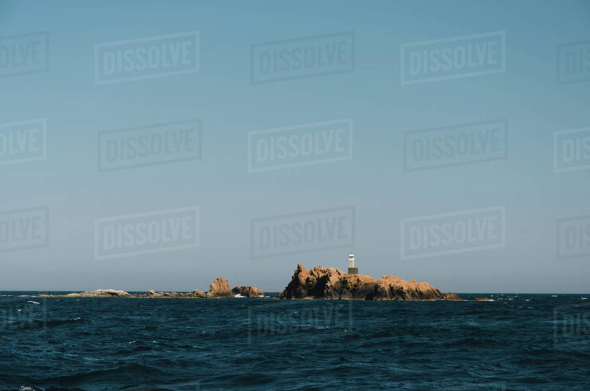 Lighthouse on rock - Stock Photo - Dissolve