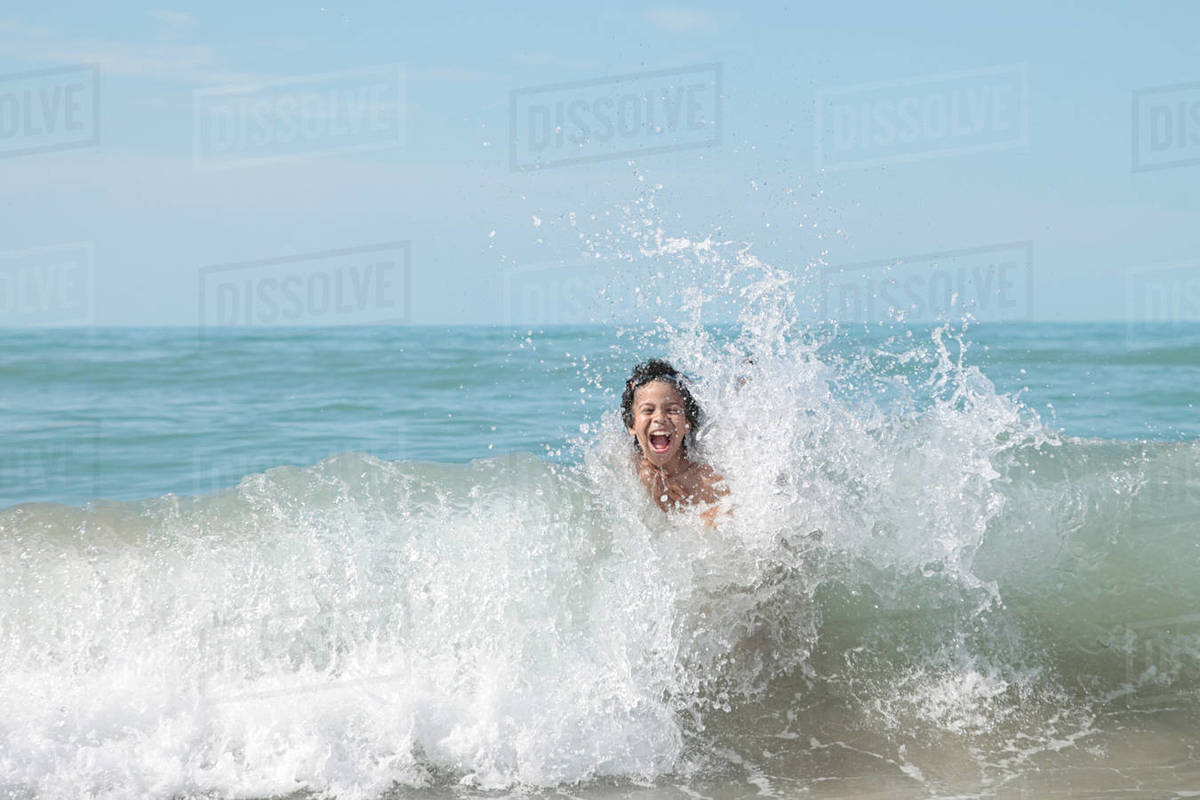 Happy boy playing in the waves, Black Sea, Bulgaria - Royalty-free ...