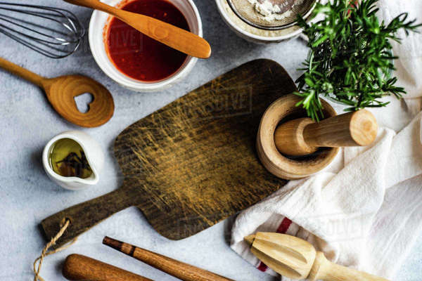 Overhead view of cooking utensils and ingredients for making pizza ...