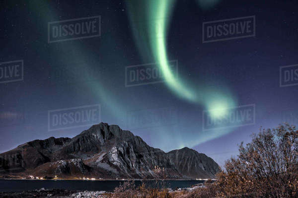 Northern lights and milky way over coastal landscape, Flakstad, Lofoten ...