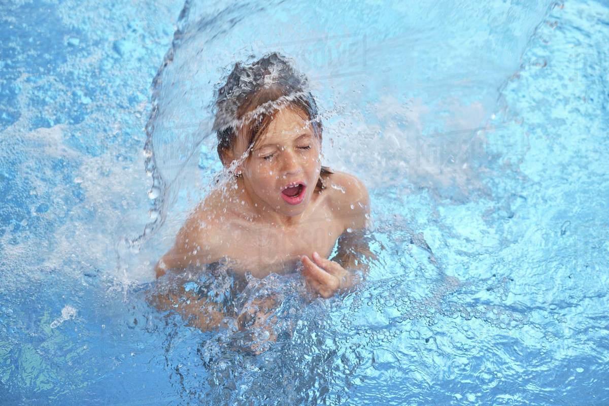 Child gasping for air with closed eyes and open mouth while floating ...