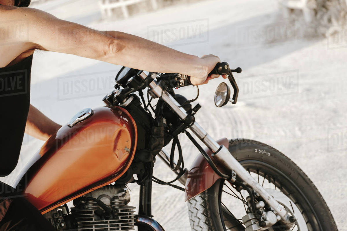 Strong man driving motorcycle - Royalty-free Stock Photo | Dissolve