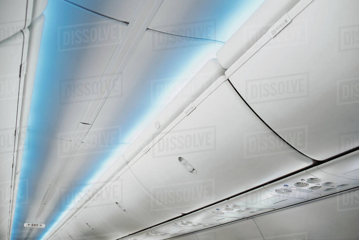 White aircraft ceiling compartment with different buttons - Royalty ...
