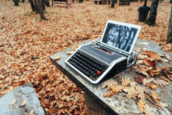 From above vintage old typewriter with a tablet instead of paper in ...