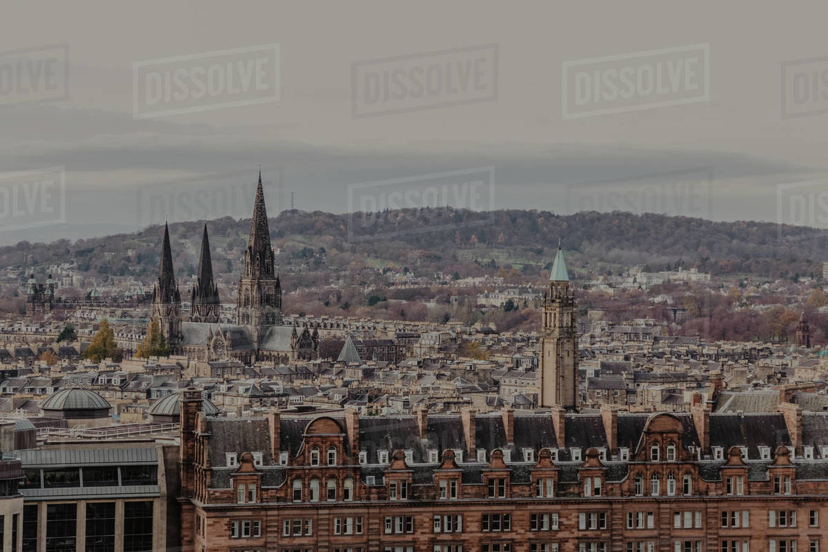 Tall tower cranes located in historic district of aged coastal city ...