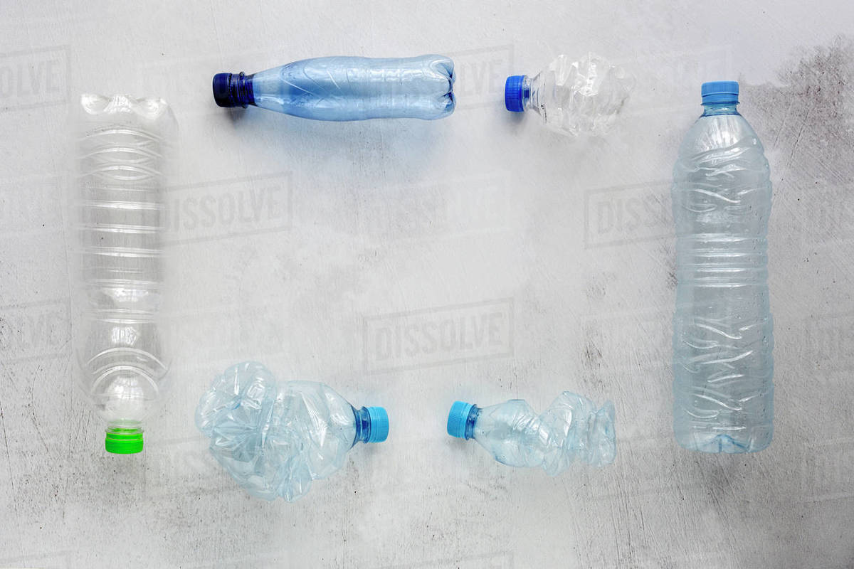 Top view of plastic bottles and boxes arranged on white background ...