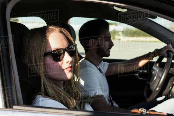 Side view of positive relaxed young woman enjoying view from passenger ...