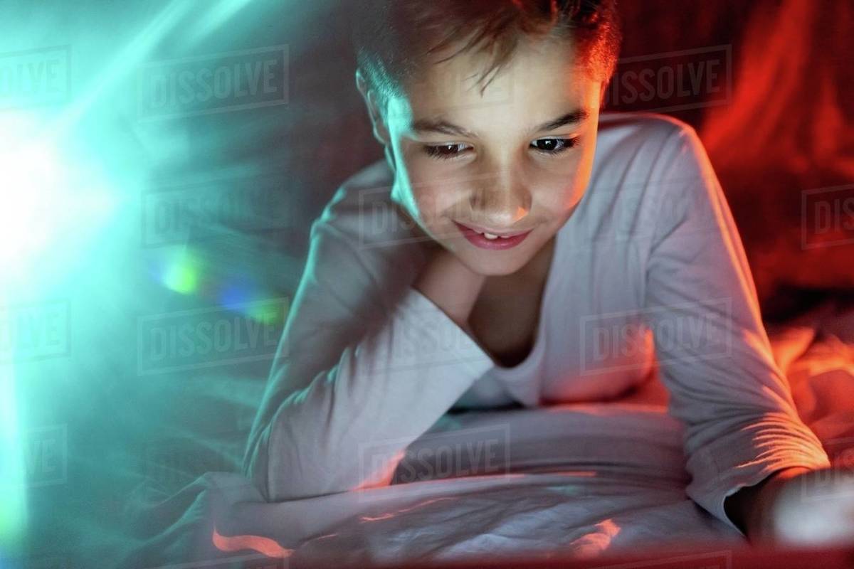 Delighted boy watching cartoon on tablet - Royalty-free Stock Photo ...