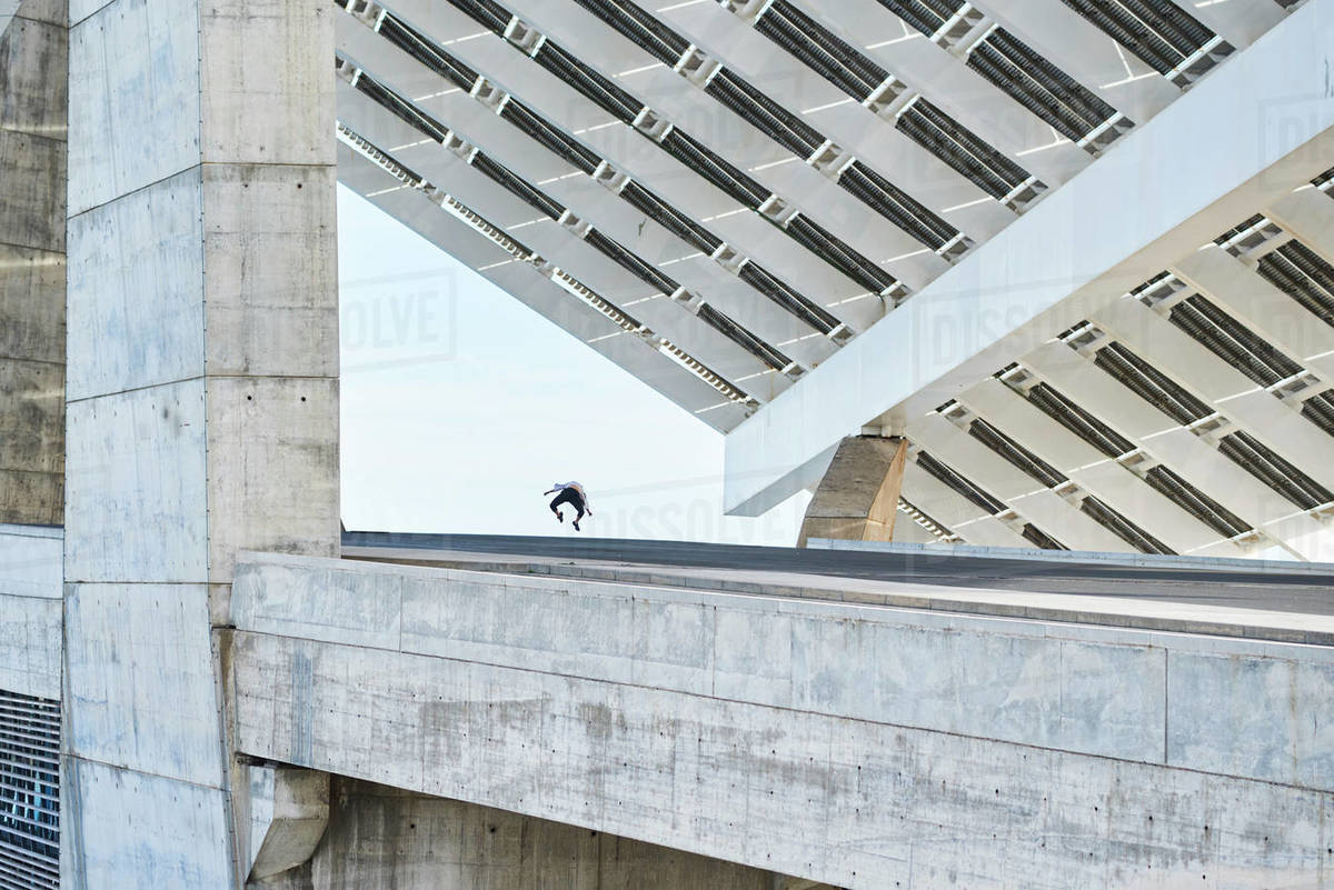 From below of anonymous person jumping or falling down from ...