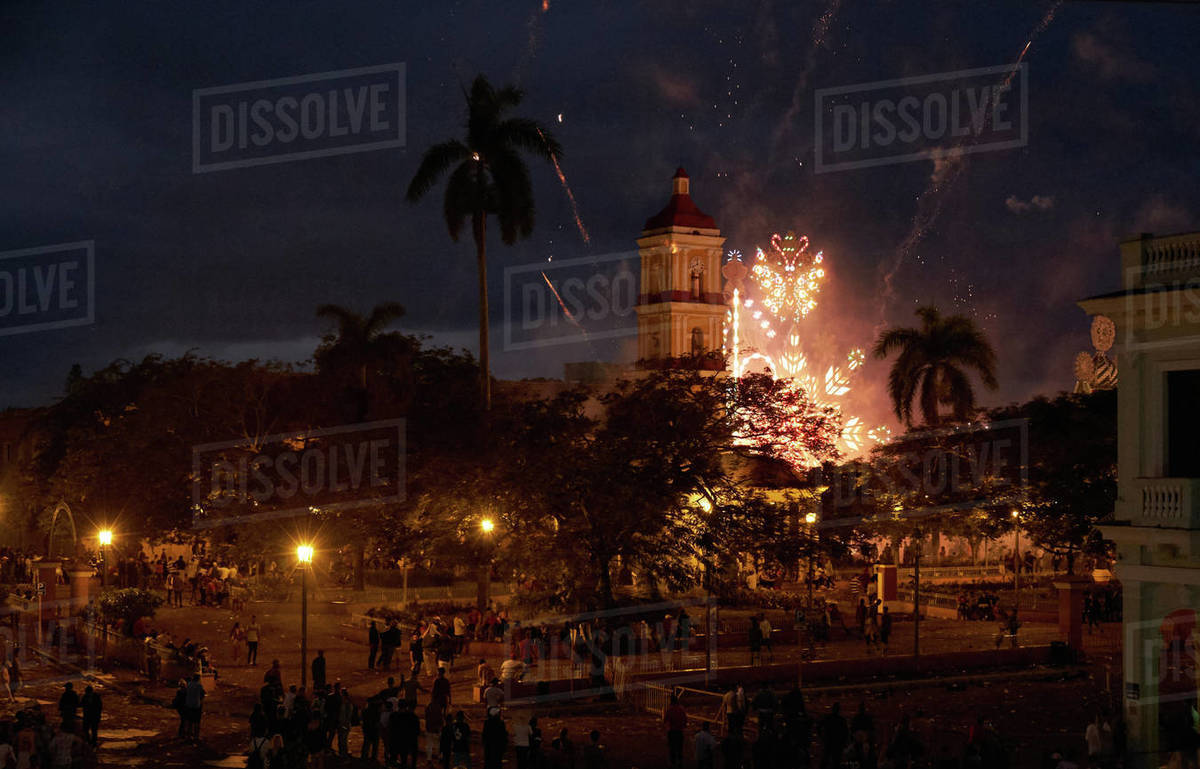 From above people celebrating holiday on square with high tower in ...