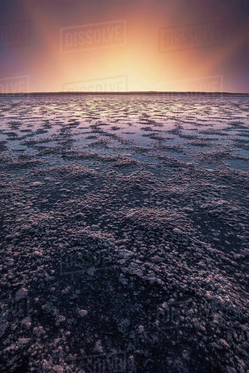 Beautiful colorful sunset sky over dried river with drought and damp ...