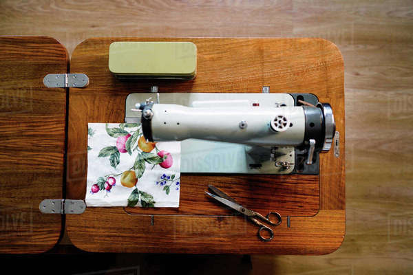 From above of composition of professional metal sewing machine and ...