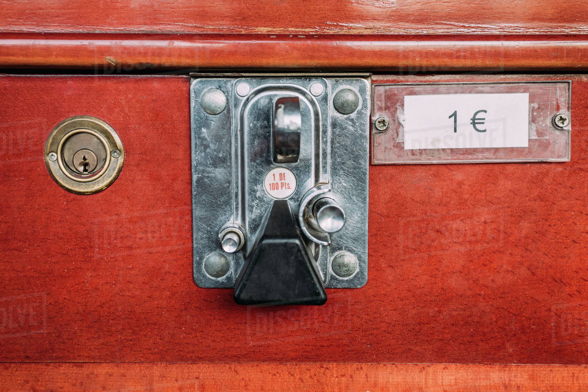 Closeup of metal insert coin slot on retro tabletop football game with ...