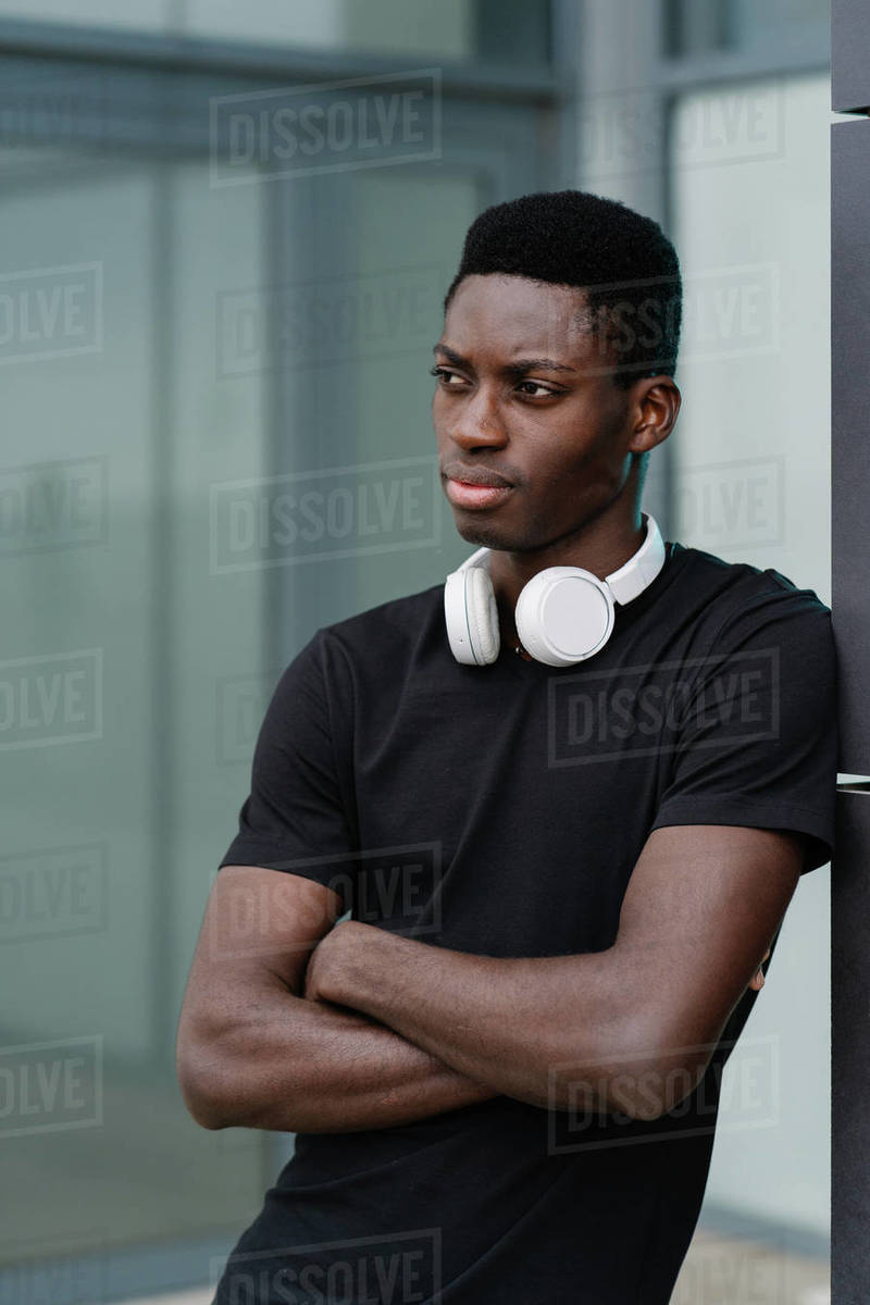 Black man with headphones on street - Stock Photo - Dissolve