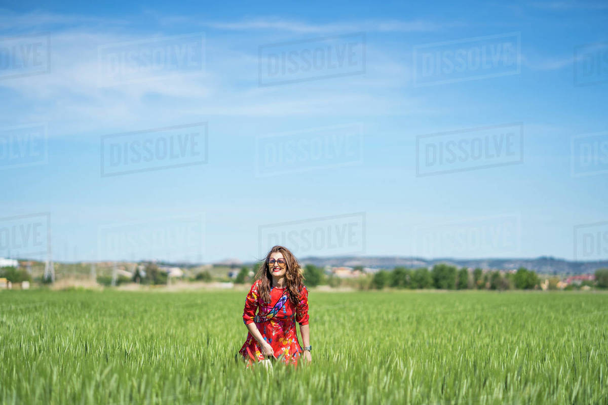 Lady standing in field - Stock Photo - Dissolve