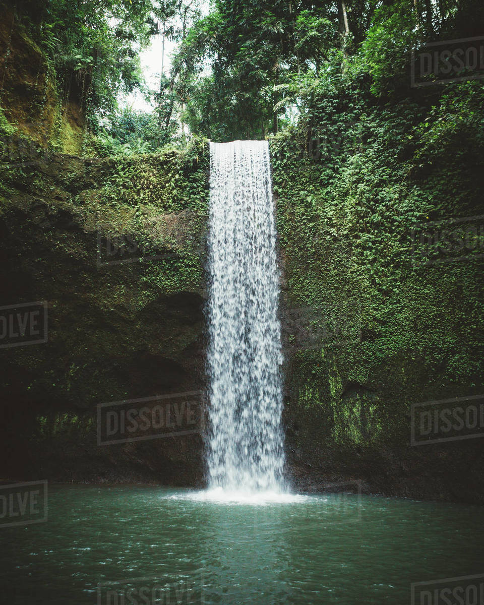 clear water of lake with waterfall on background, Bali - Stock Photo ...