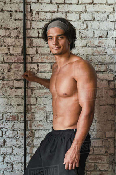 Muscular man posing in gym - Stock Photo - Dissolve