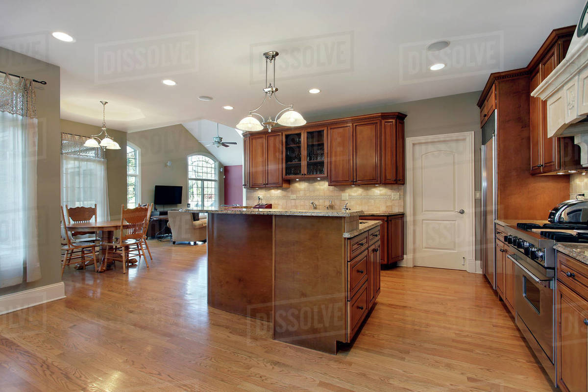 Large kitchen with view into eating area and family room - Royalty-free ...